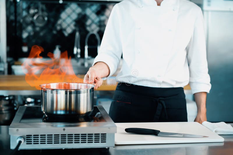 Professional Kitchen of the Restaurant, Close-up: Fire from the Pot ...