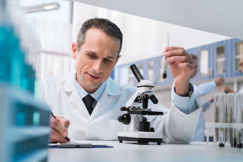 Lab Technician Taking Notes Stock Image - Image of profession ...