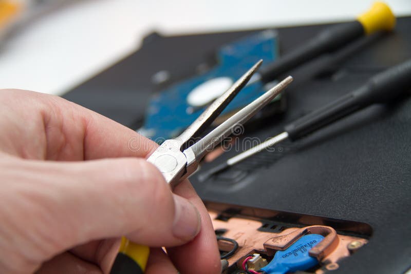 Professional laptop repair stock photo. Image of data - 49044506