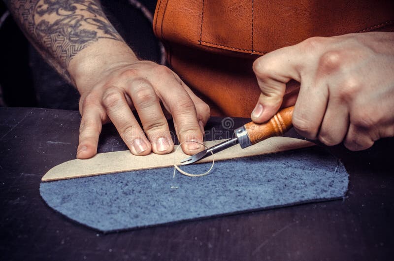 Professional Leather Worker Focused on His Work in a Workshop Stock ...