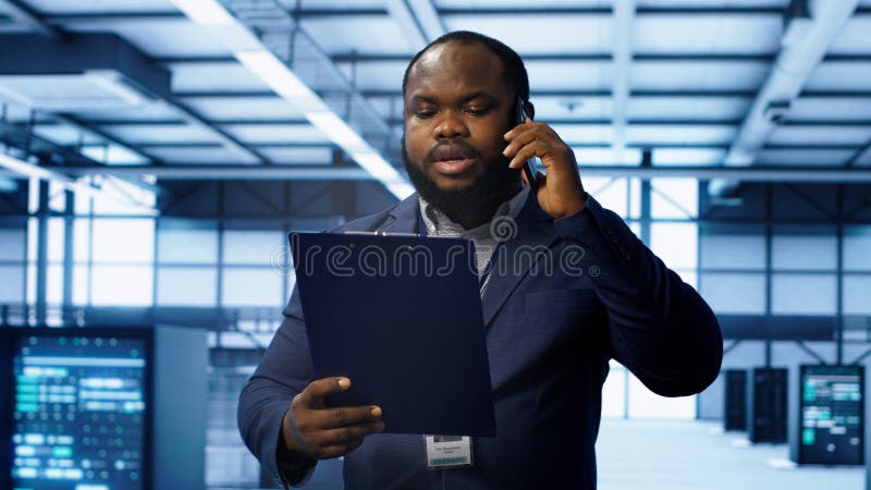 It Professional Looking Over Data Center Checkup Checklist Paperwork ...