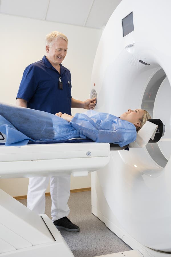Professional Looking at Patient Undergoing CT Scan Stock Image - Image ...