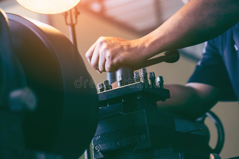 Professional Machinist : Man Operating Lathe Grinding Machine Stock ...