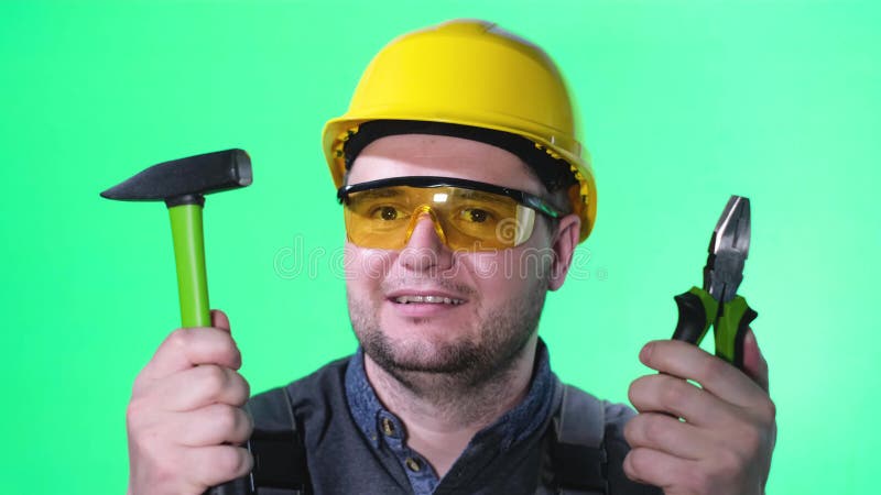 Professional Male Builder on Green Screen. he Holds Tools in His Hands ...
