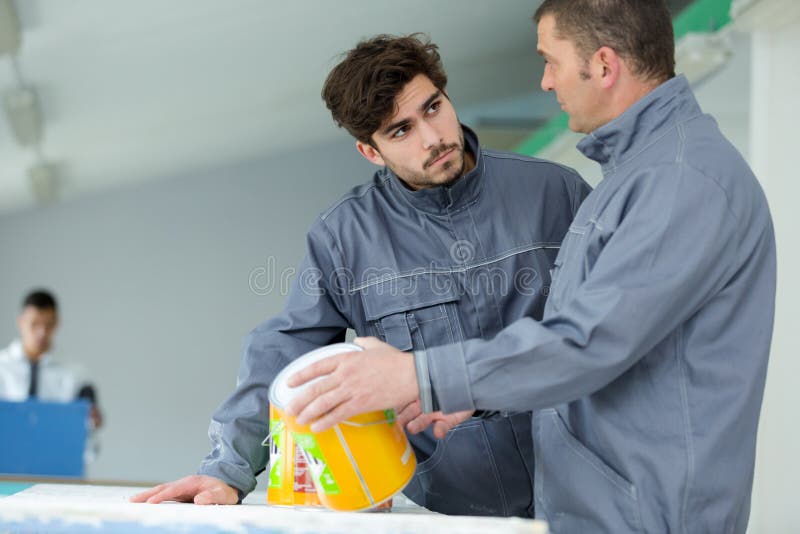 Professional Male Construction Crew in Uniforms at Work Stock Image ...
