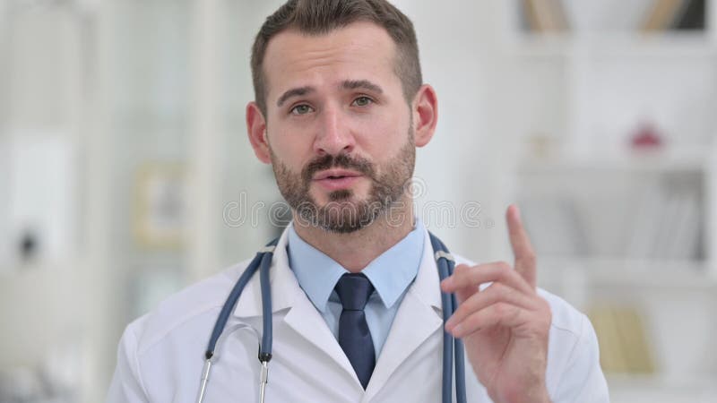 Professional Male Doctor Talking on Video Call Stock Photo - Image of ...