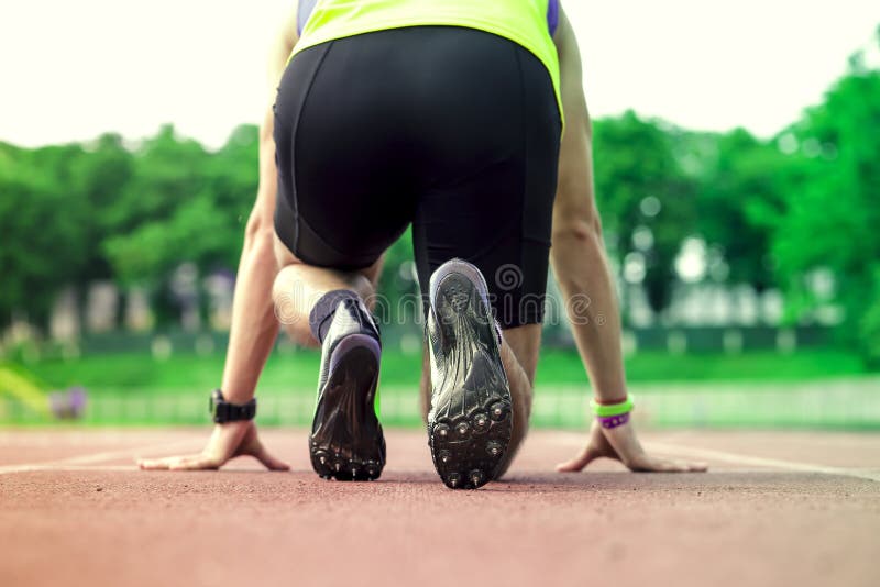 Professional Male Runner Taking Ready To Start Position Stock Image ...