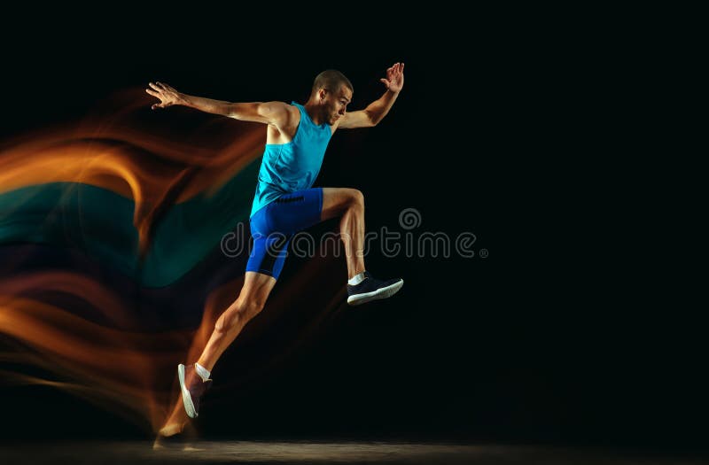 Professional Male Runner Training Isolated On Black Studio Background ...