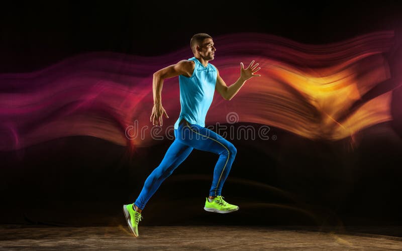 Professional Male Runner Training Isolated on Black Studio Background ...