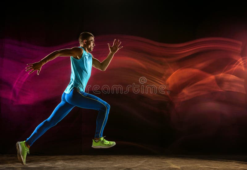 Professional Male Runner Training Isolated on Black Studio Background ...