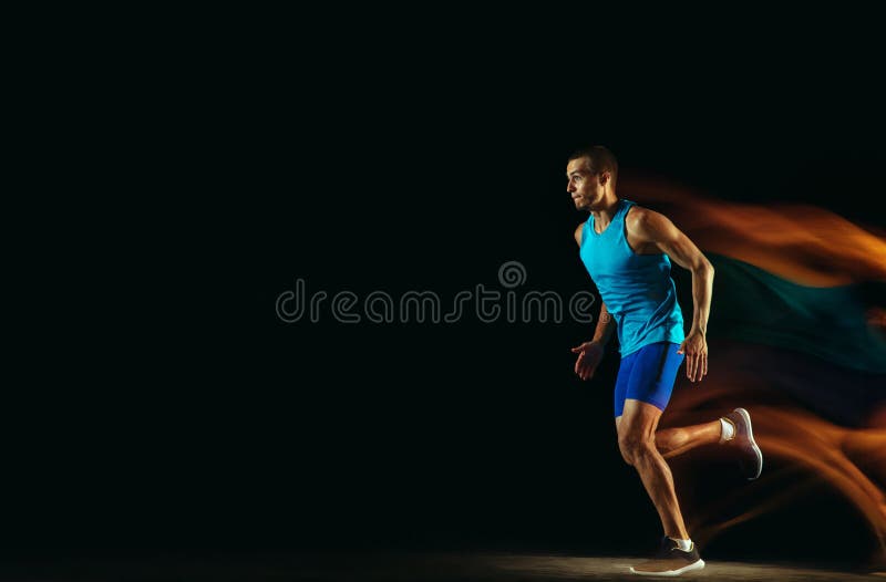 Professional Male Runner Training Isolated on Black Studio Background ...