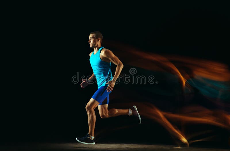 Professional Male Runner Training Isolated On Black Studio Background ...