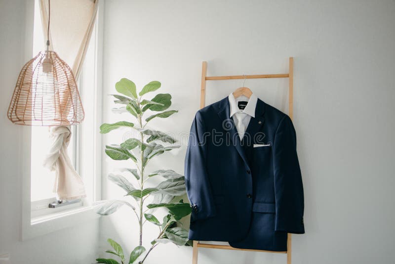 Professional Male S Suit Hanging from the Wall in the Room Stock Image ...