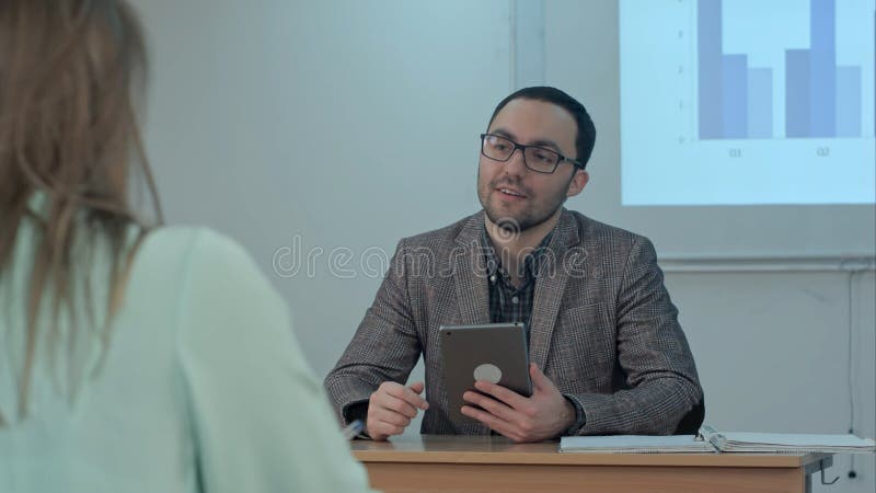 Professional Male Teacher Explaining Main Ideas of Essay Making ...