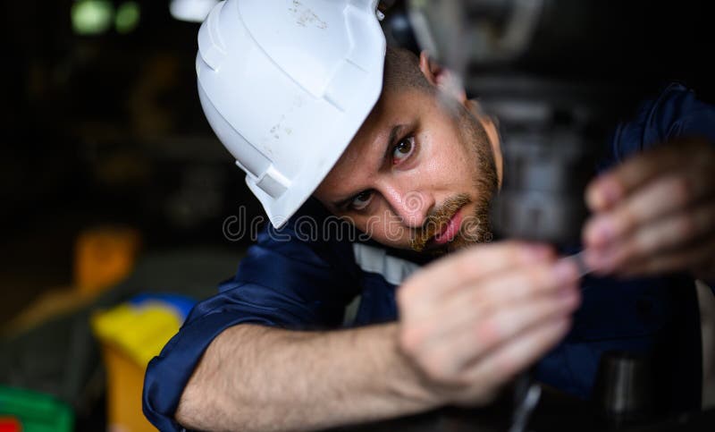 Professional Male Technician Engineer Checking Machine at Manufacturing ...