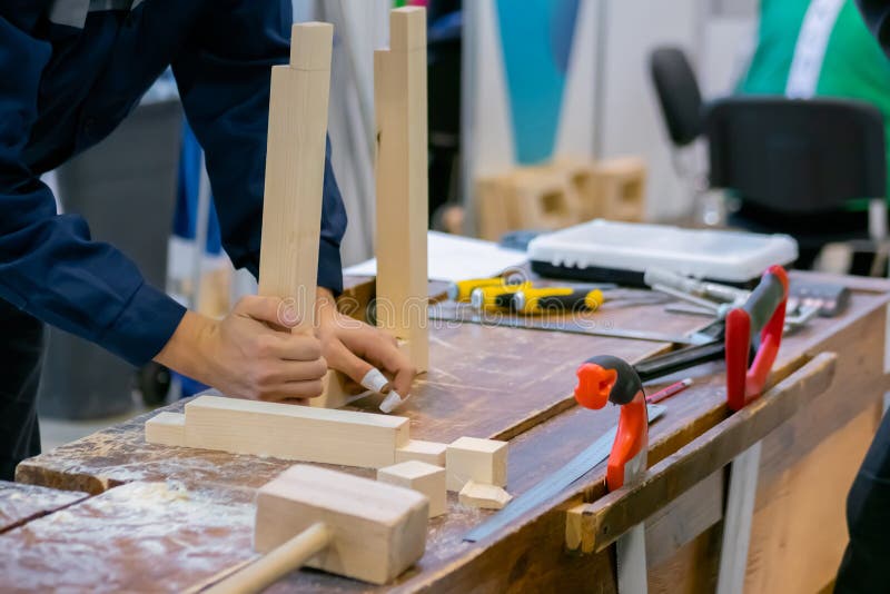 Professional Man Carpenter Working with Wooden Detail - Assembling ...
