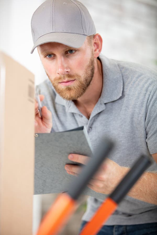 Professional Man Checking Details on Cardboard Box Stock Image - Image ...