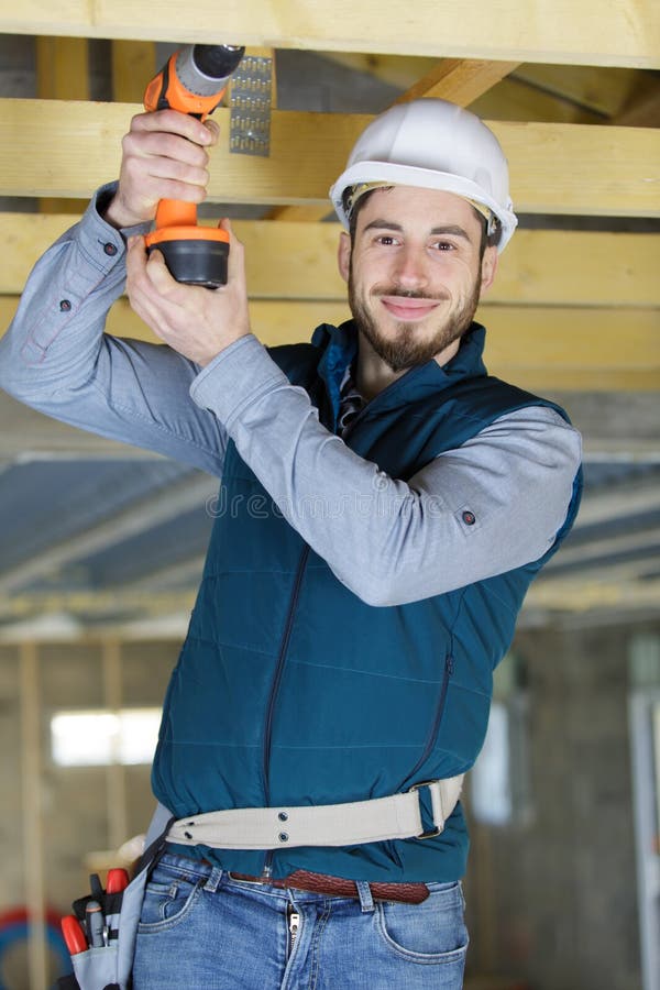 Professional Man Drilling into House Ceiling Stock Photo - Image of ...