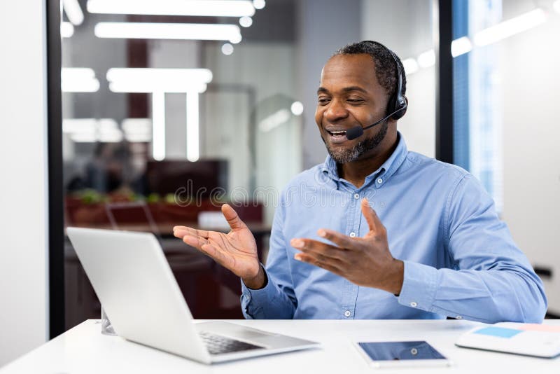 Professional Man Engaged in Video Conference Call with Headset at ...