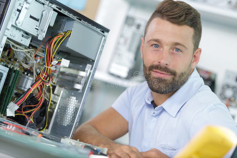 Professional Computer Engineer Talking To Customer while Fixing Pc ...