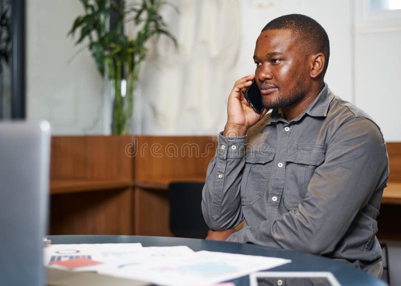 Professional Man Talking on Phone in Modern Office Setting for Work ...