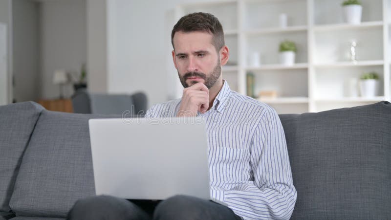 Professional Man Thinking and Working on Laptop at Home Stock Image ...