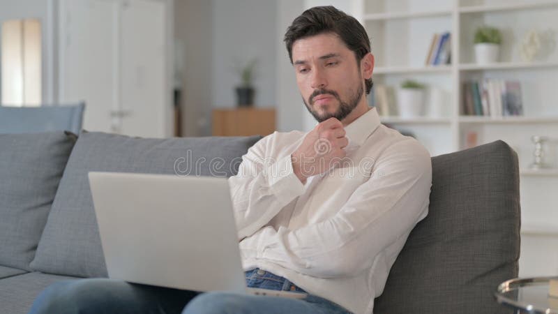 Professional Man Thinking and Working on Laptop at Home Stock Photo ...