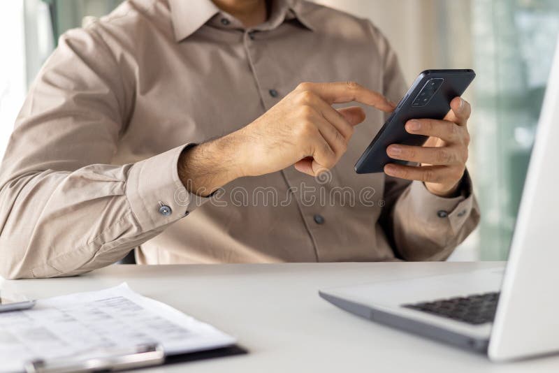 Professional Man Using Smartphone at Office Desk Stock Photo - Image of ...