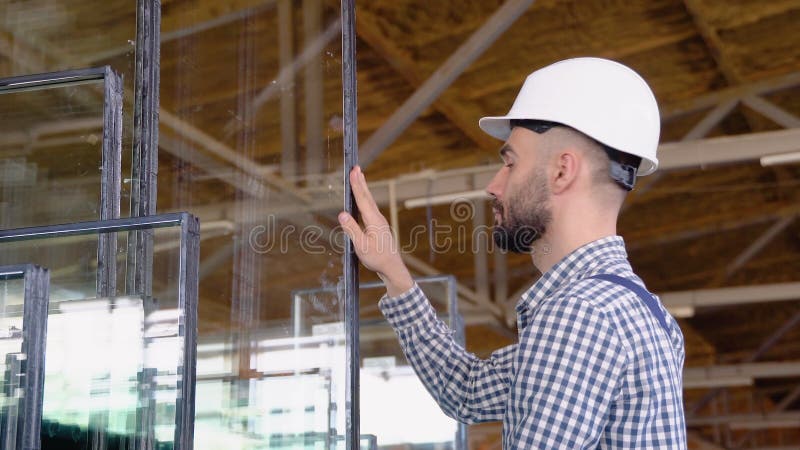 Professional Man Worker in Uniform and Helmet in a Window Warehouse ...