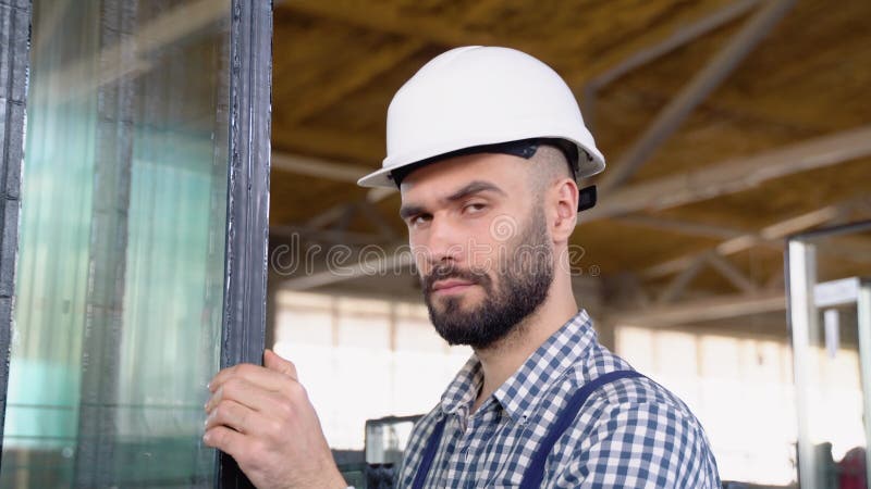 Professional Man Worker in Uniform and Helmet in a Window Warehouse ...