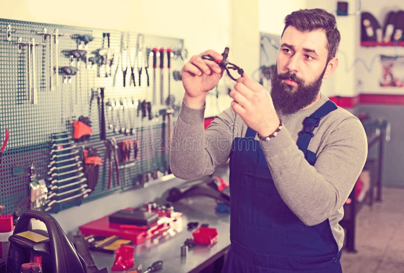 Professional Man Worker Working at Restoring Motorbike in Workshop ...