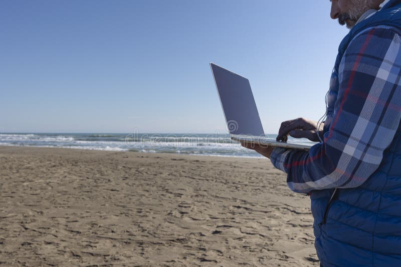 Professional Man Working on a Laptop on the Beach Stock Image - Image ...