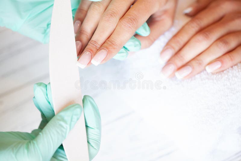 Professional Manicure Procedure. Nails Master Doing Manicure in Beauty ...