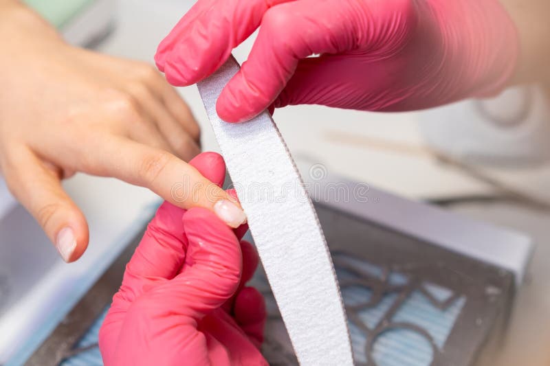 Professional Manicure Services with a Nail File in a Beauty Salon Stock ...