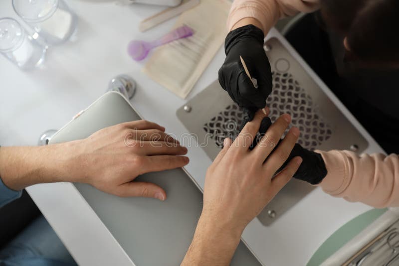 Professional Manicurist Working with Client in Beauty Salon Stock Photo ...