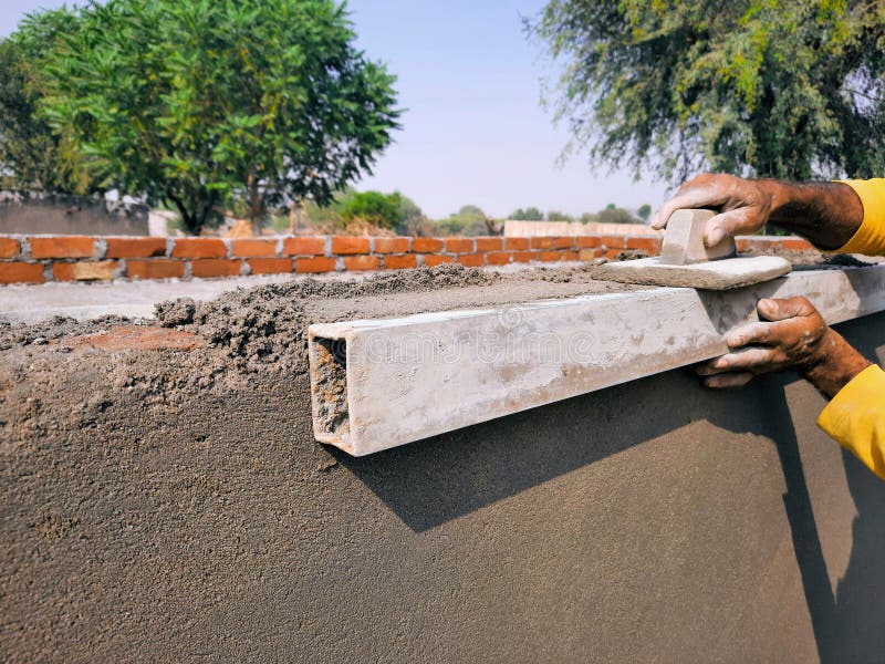 Professional Mason Building Sharp Edges of Wall with Construction Tools ...
