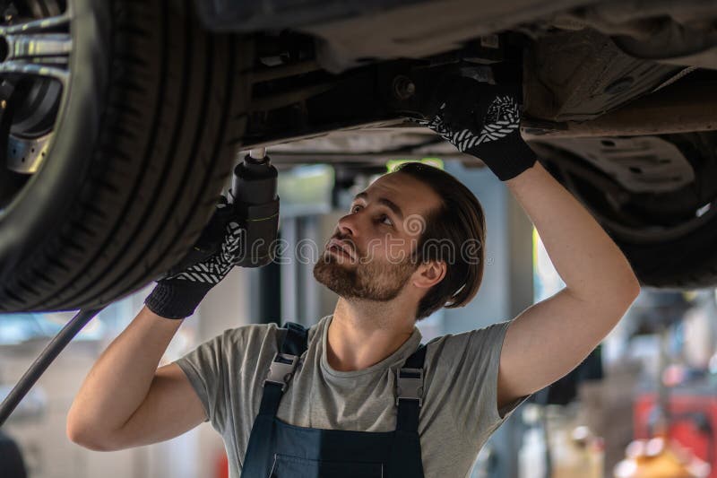 Professional Mechanic Busy Repairing the Client Automobile Stock Image ...