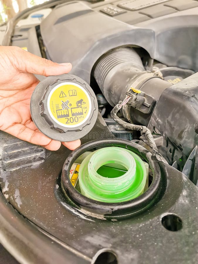 A Professional Mechanic is Checking Coolant Radiator Water Stock Image ...
