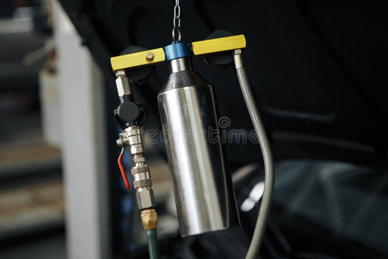 Professional Mechanic Testing Diesel Injector in His Workshop. Stock ...