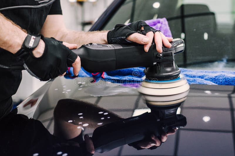 Professional Mechanic Using a Polisher To Shine a Car Stock Photo ...