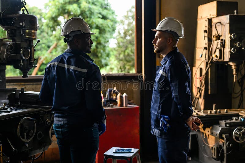 Professional Mechanical Engineer Team Checking and Repairing Engine ...