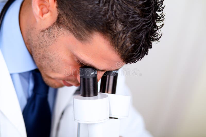 Professional Medical Man Using a Microscope Stock Photo - Image of ...