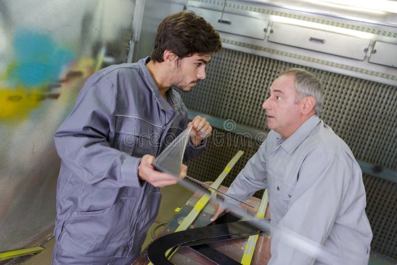 Professional Metallurgist with Apprentice Stock Photo - Image of ...