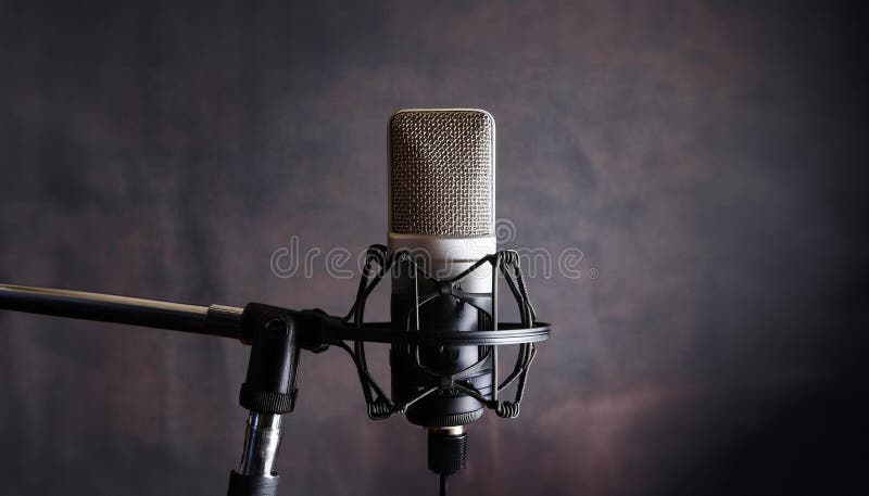 A Professional Microphone Against a Dark, Textured Backdrop ...