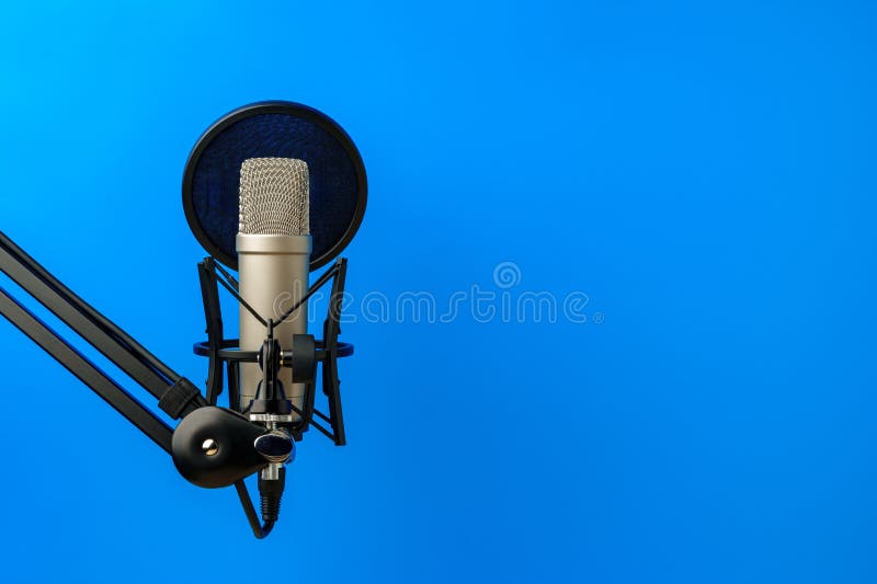 Professional Microphone Stand Over Blue Studio Background Stock Image ...