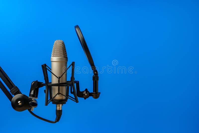 Professional Microphone Stand Over Blue Studio Background Stock Image ...