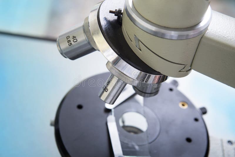 Microscope Close-up. Shot of Microscope with Metal Lens with Abstract ...