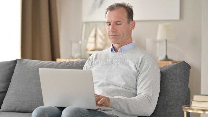 Professional Middle Aged Businessman Using Laptop on Sofa Stock Photo ...