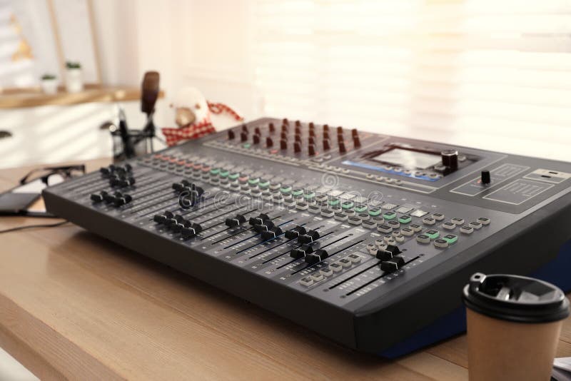 Professional Mixing Console on Wooden Table in Modern Radio Studio ...