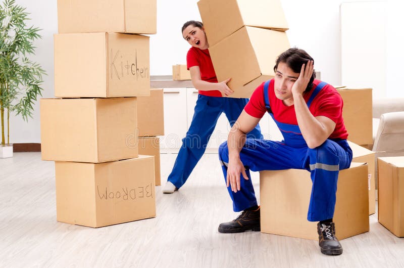 The Professional Movers Doing Home Relocation Stock Photo - Image of ...